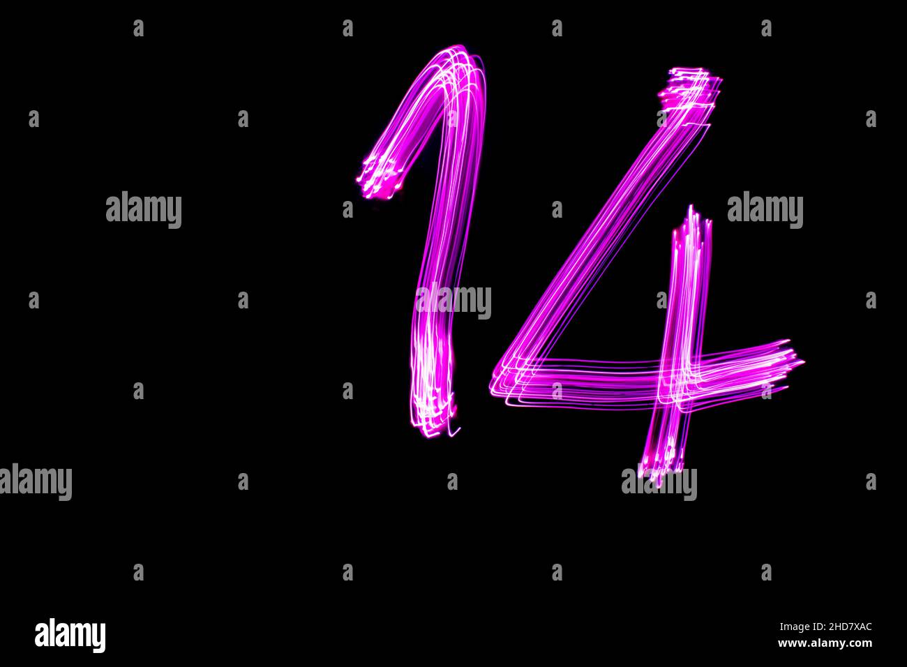 Number 14 neon, light painting number 14 against black background ...