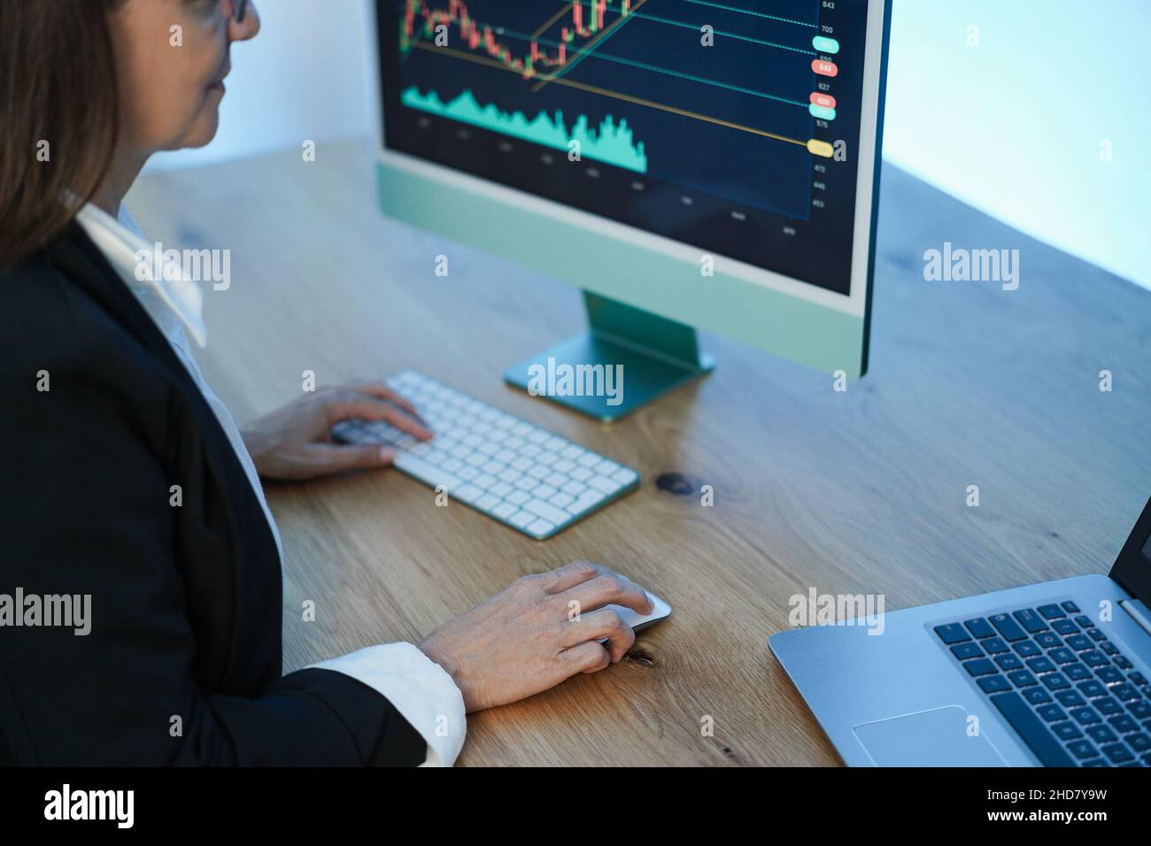 Trader woman studying stock market at home - Focus on right hand Stock ...