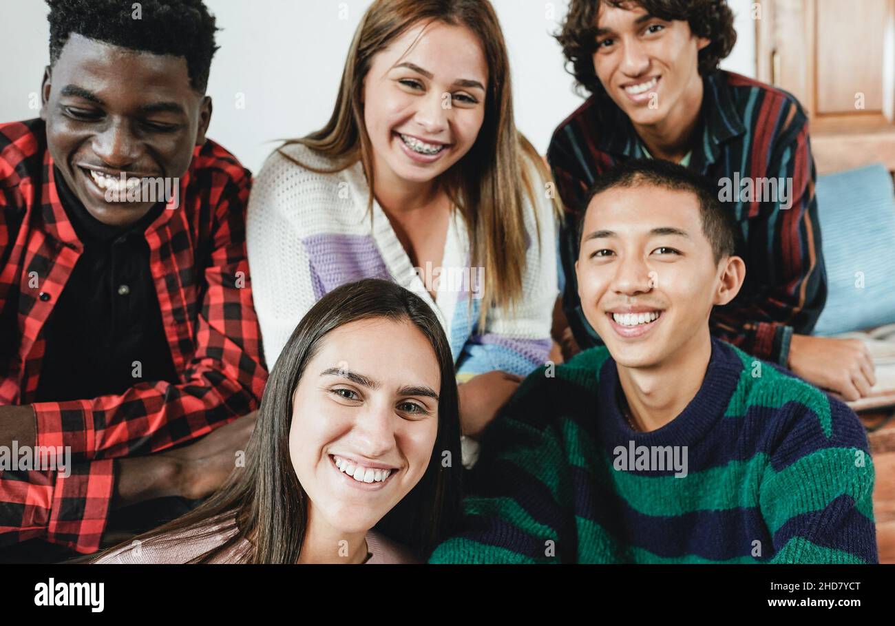 Multiracial young friends smiling on camera - Focus on bottom girl face ...