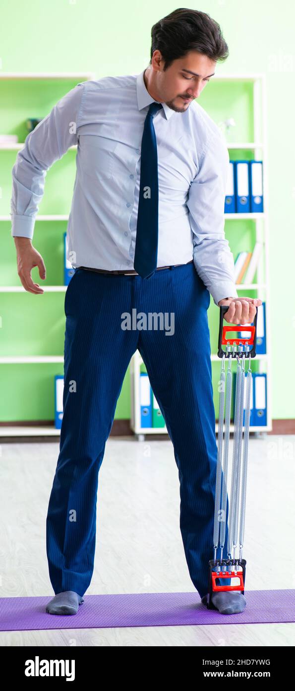 The employee doing exercises during break at work Stock Photo - Alamy