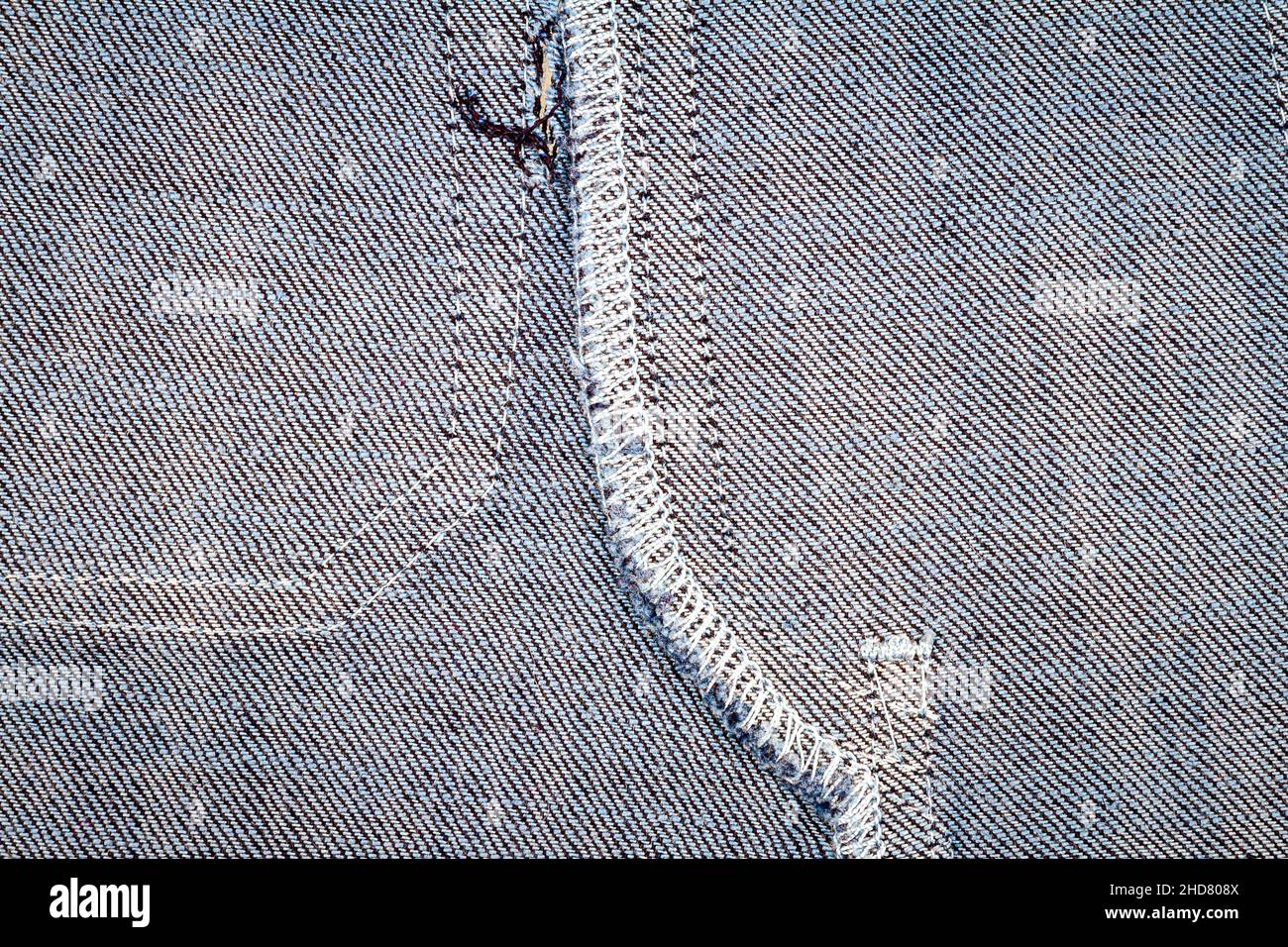 Back side of jeans fabric with a seam Stock Photo - Alamy