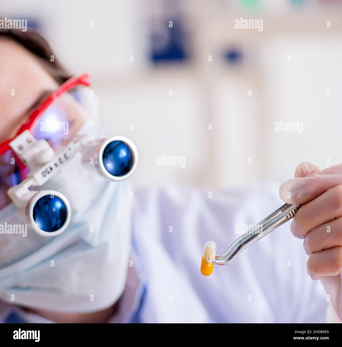 The lab assistant in drug synthesis concept Stock Photo - Alamy