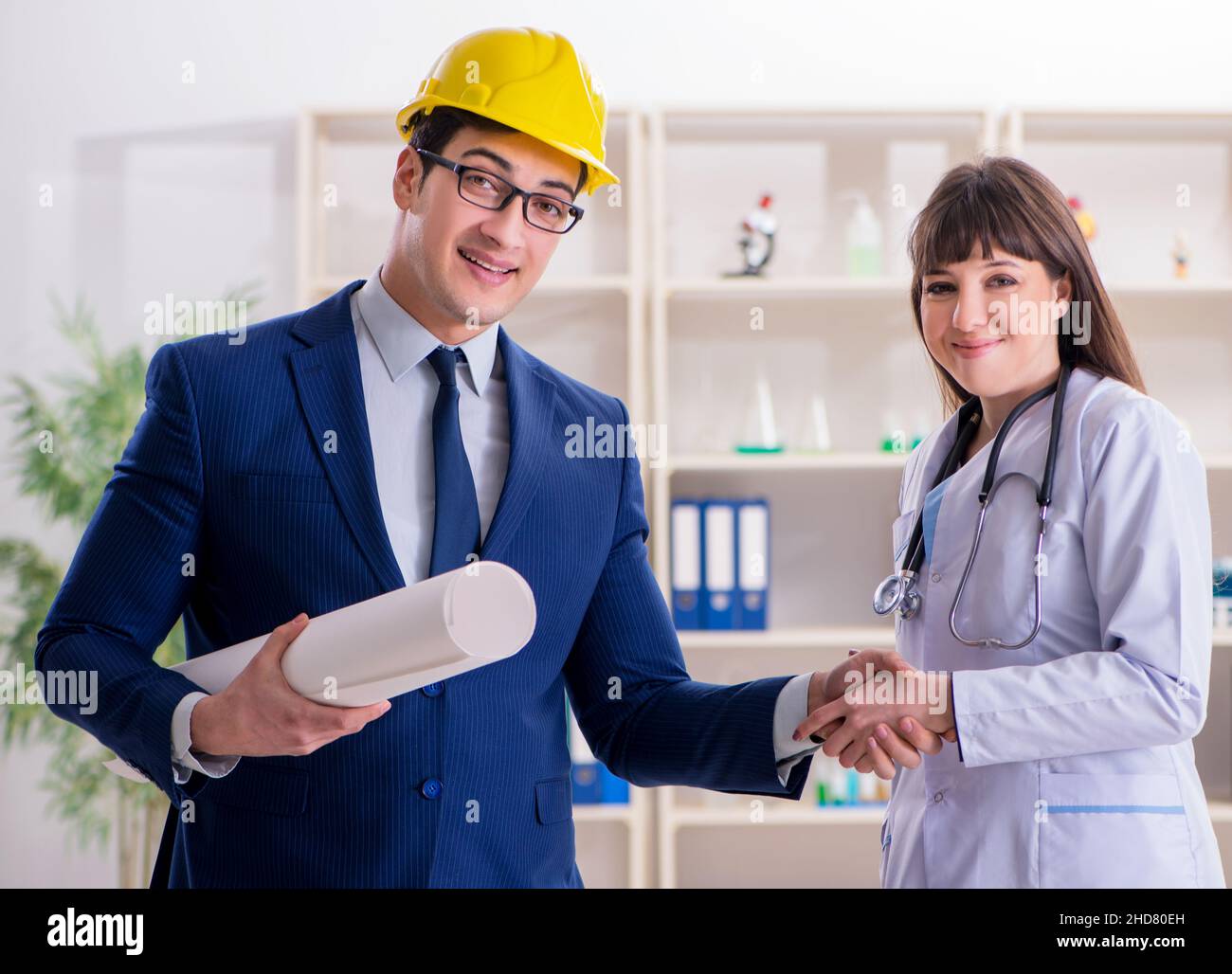 The doctor discussing new hospital plan with architect Stock Photo - Alamy