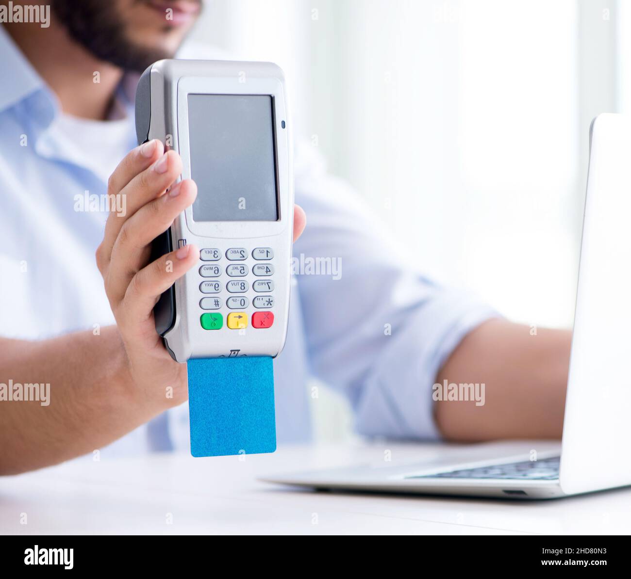 The man processing credit card transaction with pos terminal Stock ...