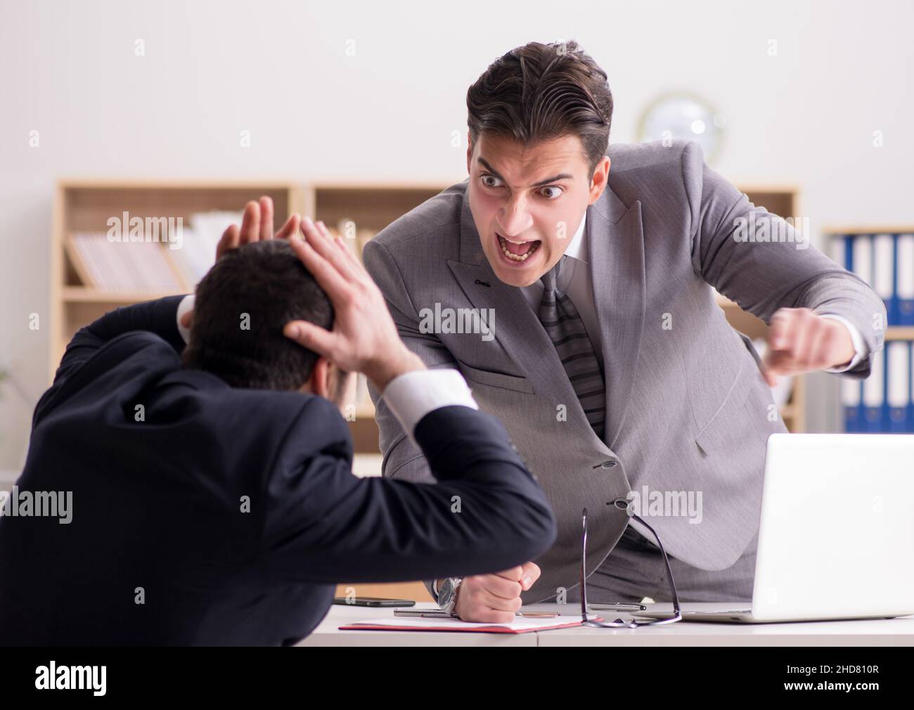 The angry boss shouting at his employee Stock Photo - Alamy