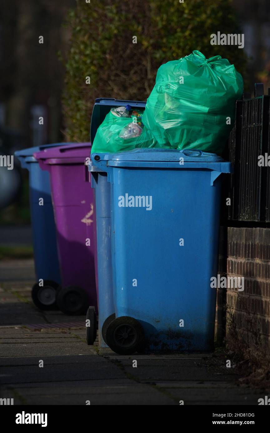 Overflowing bins awaiting collection by refuse workers in Liverpool ...