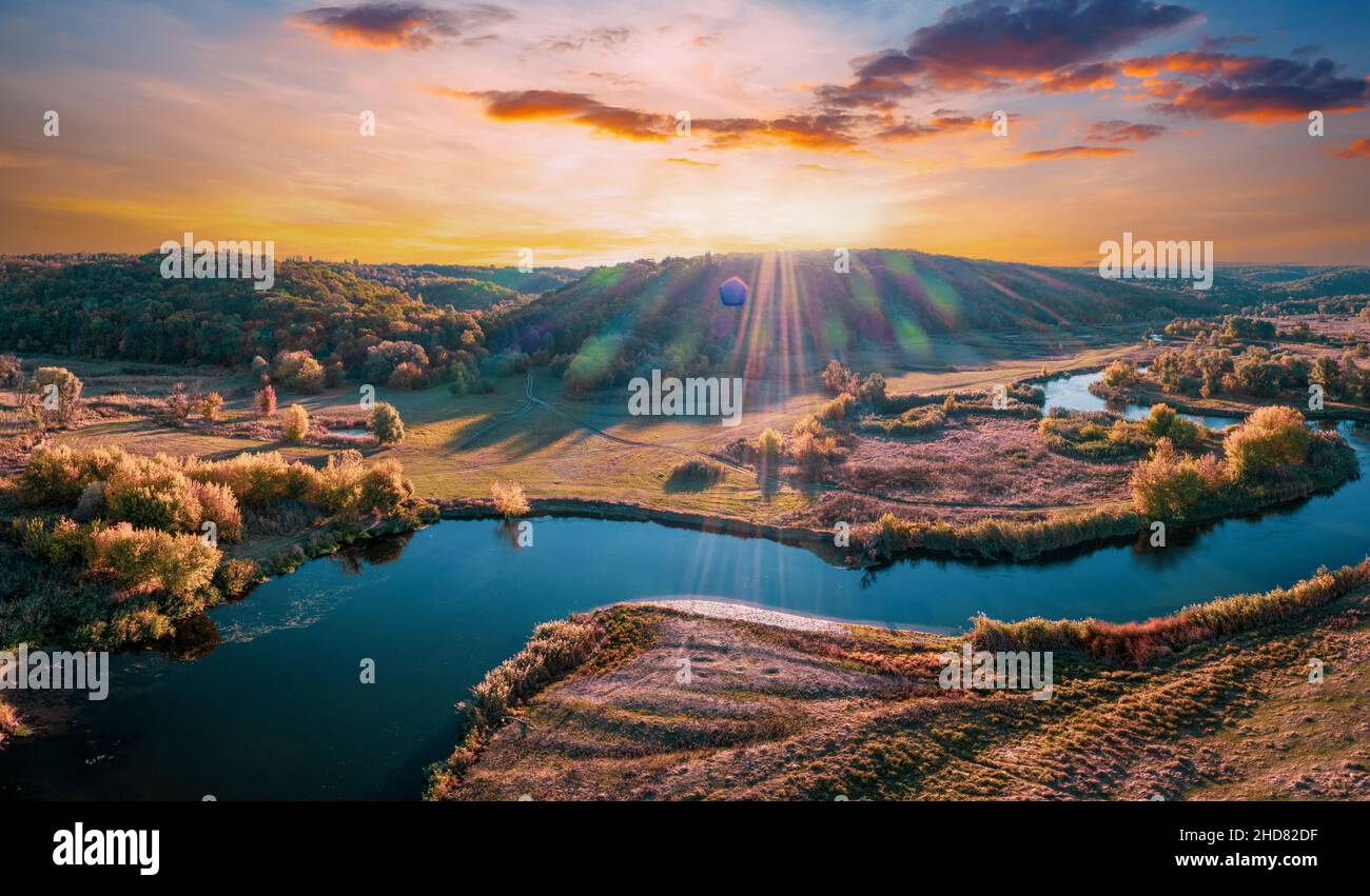 Country ground road stretching between green meadows and long narrow ...
