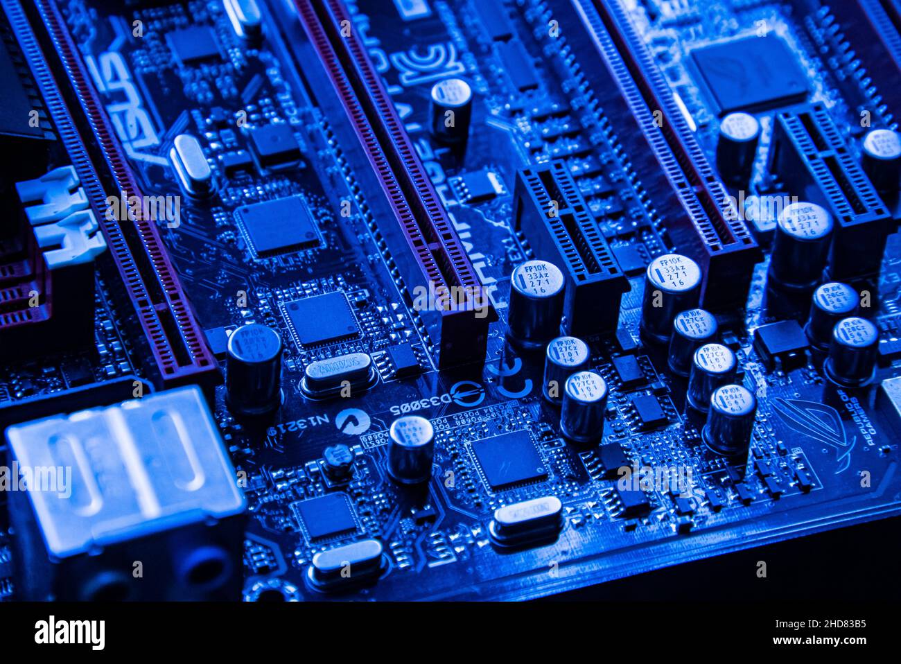 Pcie slot detail n a motherboard of a gaming pc in a blue light Stock ...