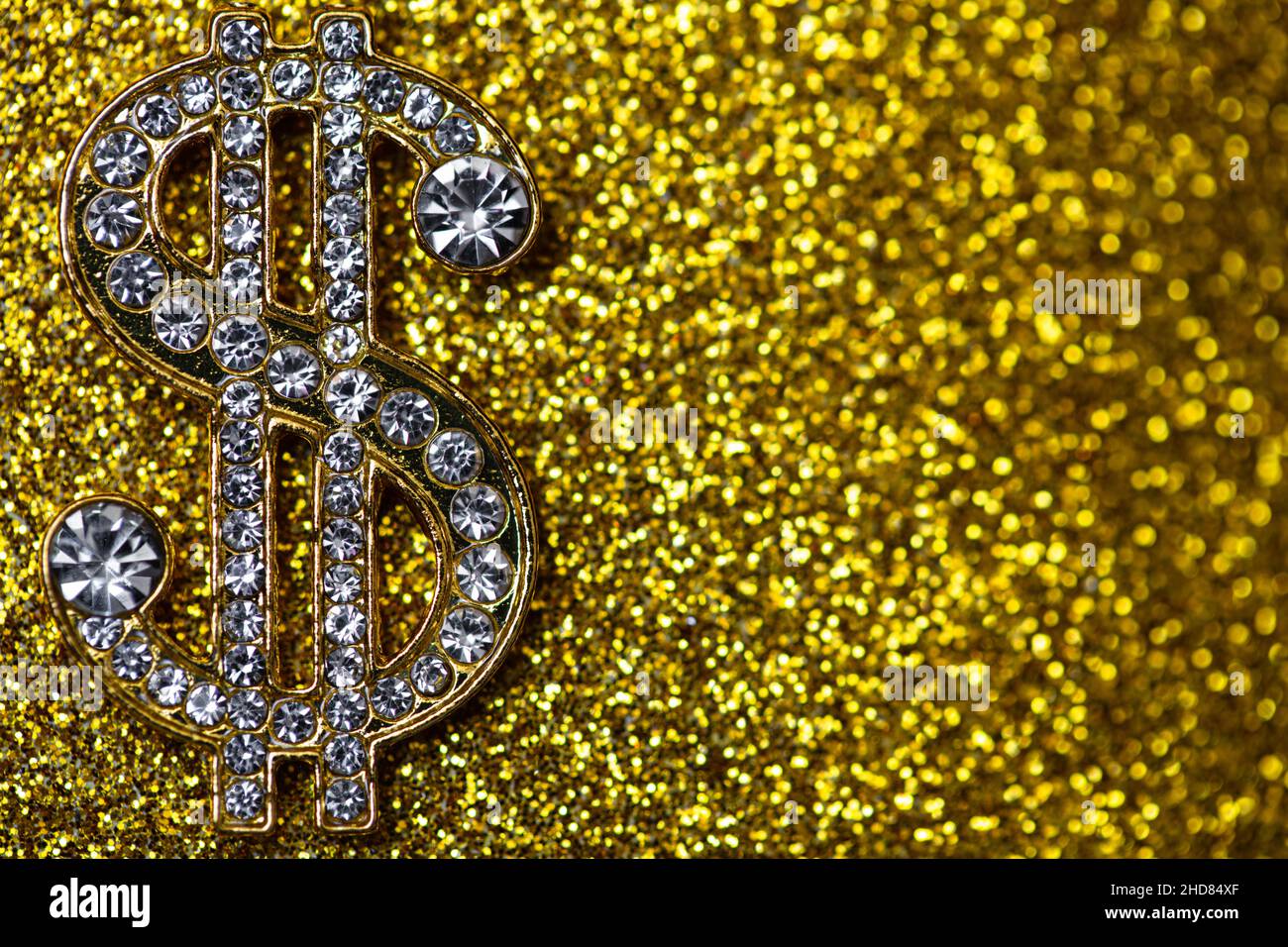 golden dollar sign with gemstones on yellow glitter background for ...