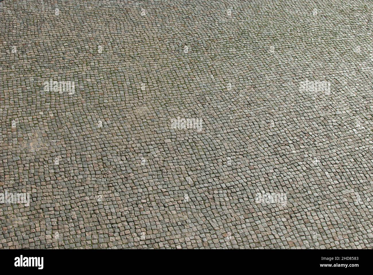 Cobblestone paved road surface as grey stone background Stock Photo - Alamy