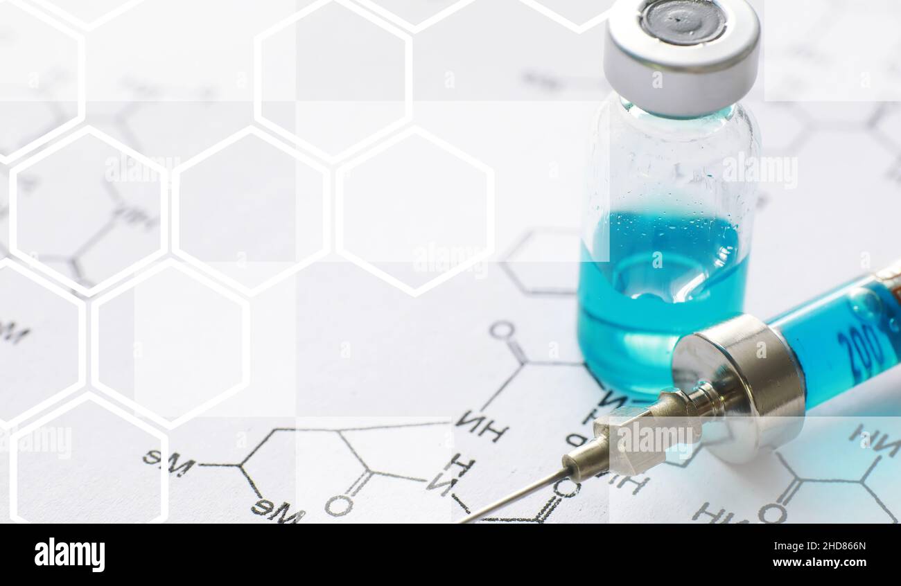 small jars with injection and syringe for injection on blue background ...