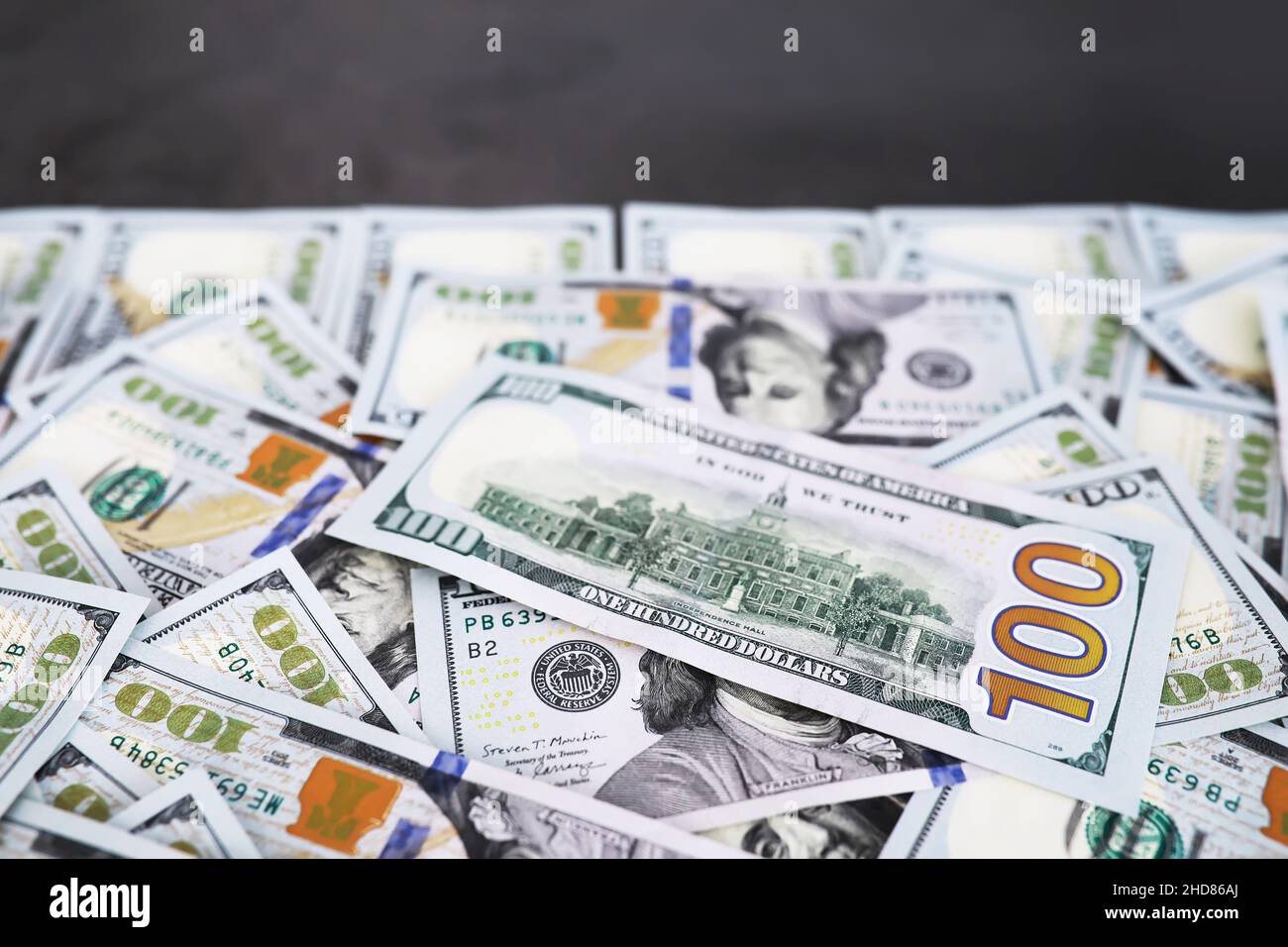 Cash money in a large pile as a finance background. Paper money close ...