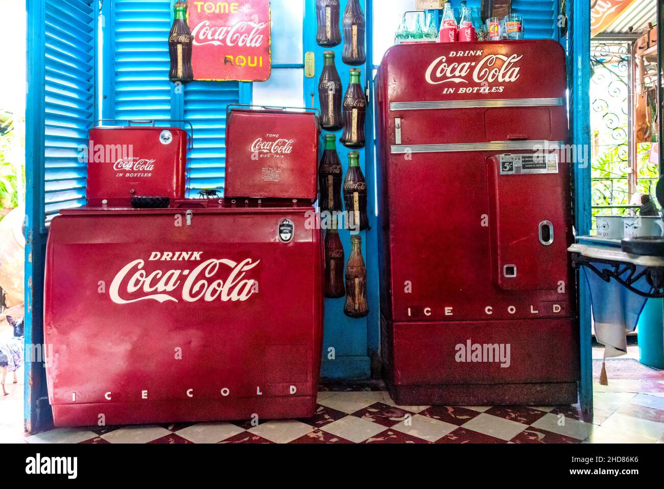 Old Coca-Cola fridges and containers. Collection of antique objects ...