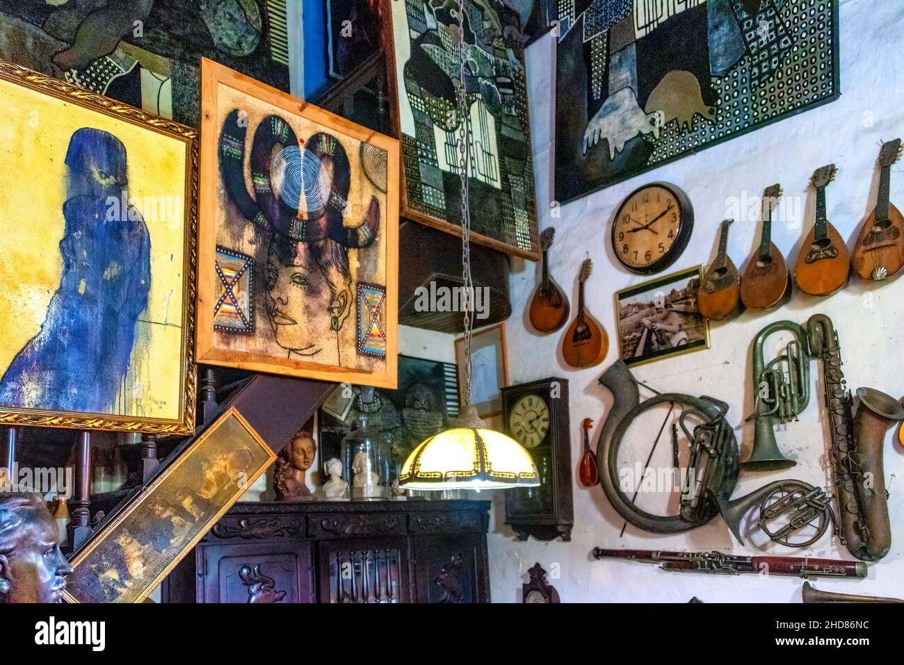 Old musical instruments. Collection of antique objects inside the house ...