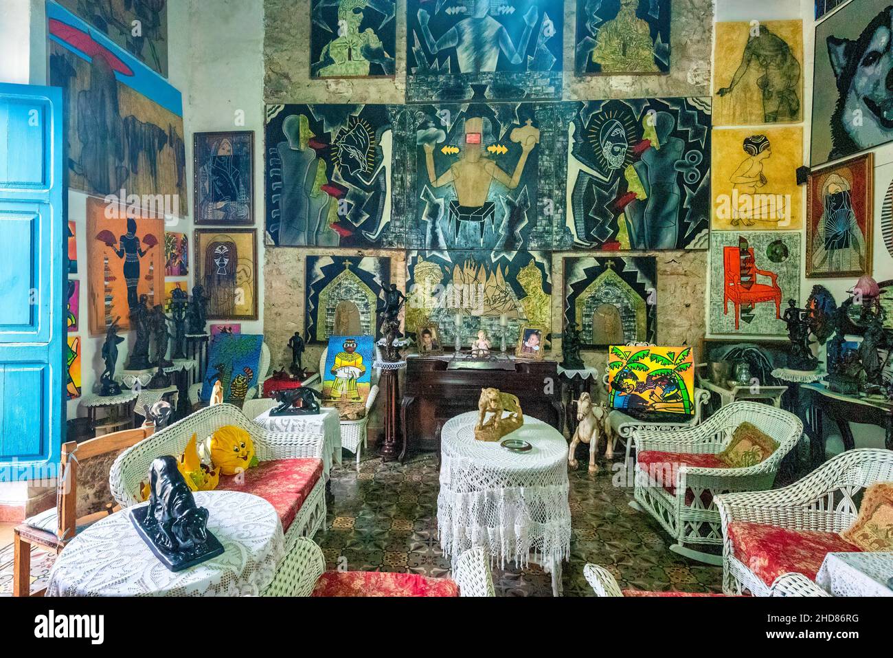 Living room decorated with diverse vintage items. Collection of antique ...