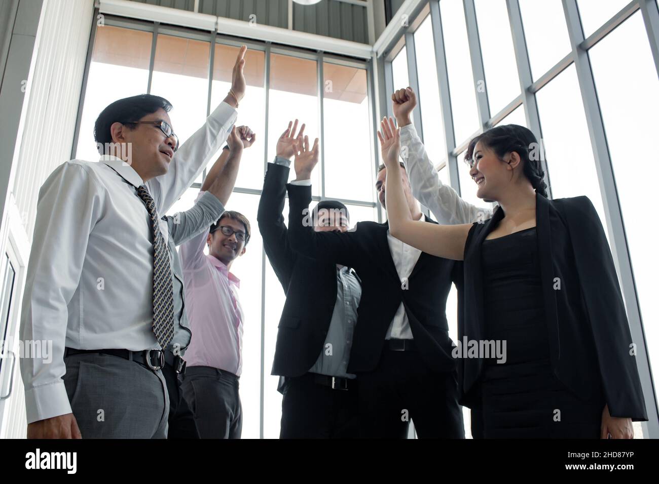 Success of team of Asian people and foreigners at meeting. Success of ...