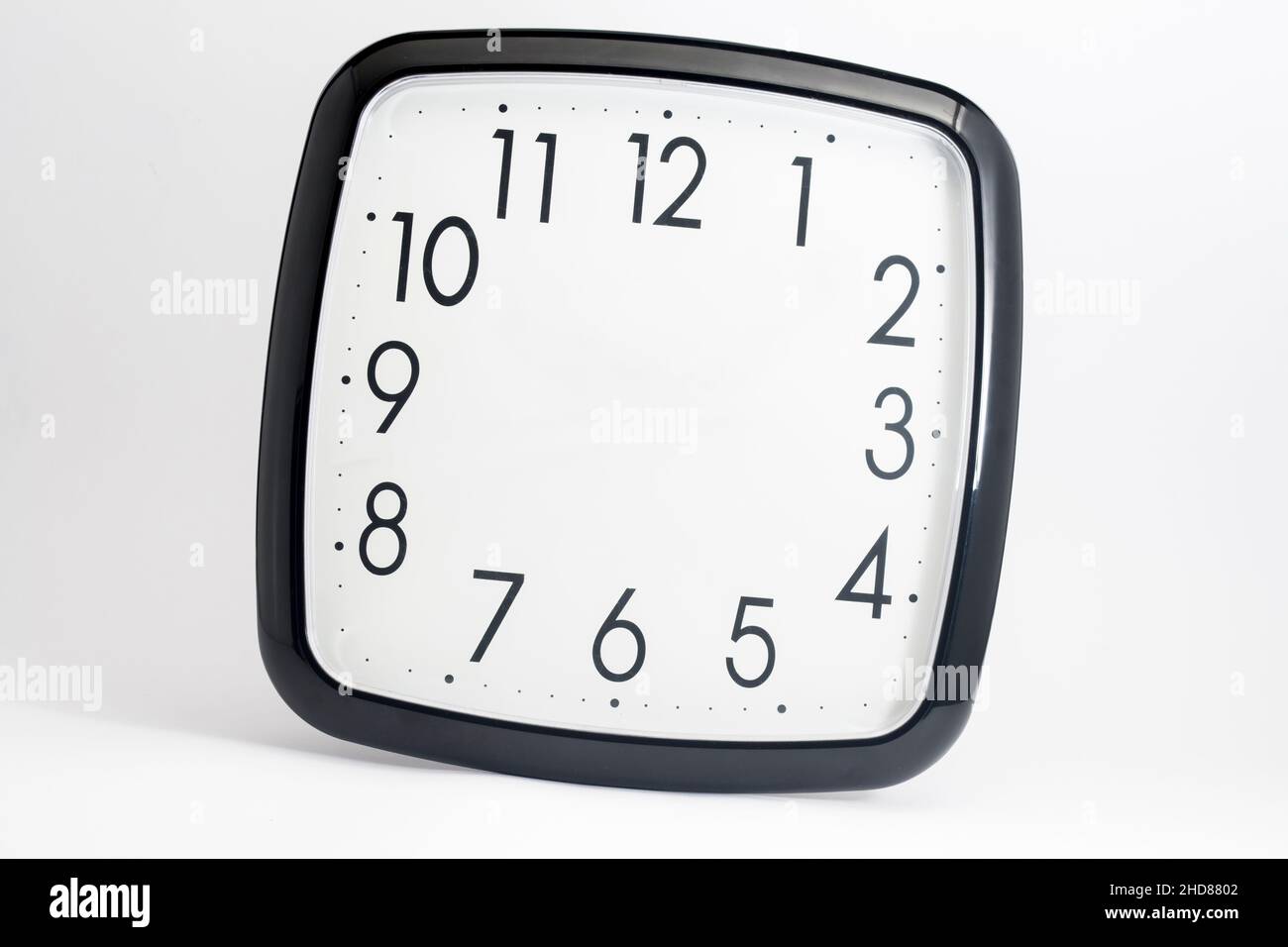 Empty black clock without dial on isolated white background with shadow ...