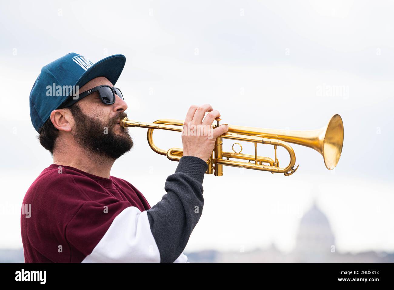 ROME, ITALY. 4 January 2022. A busker playing a trumpet on a plesant ...