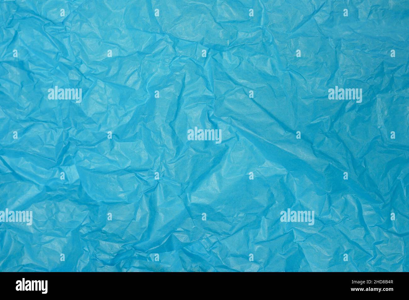 Blue package with wrinkles texture background Stock Photo - Alamy