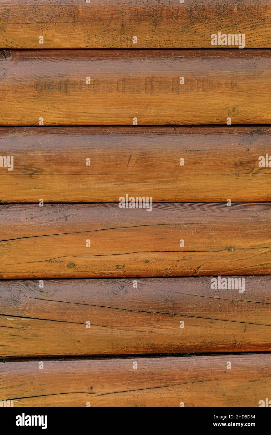 Log background. Rough wood texture. The walls of a country house are ...