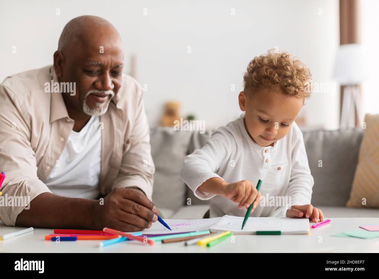 African American Grandpa And Grandson Sketching Together Drawing ...