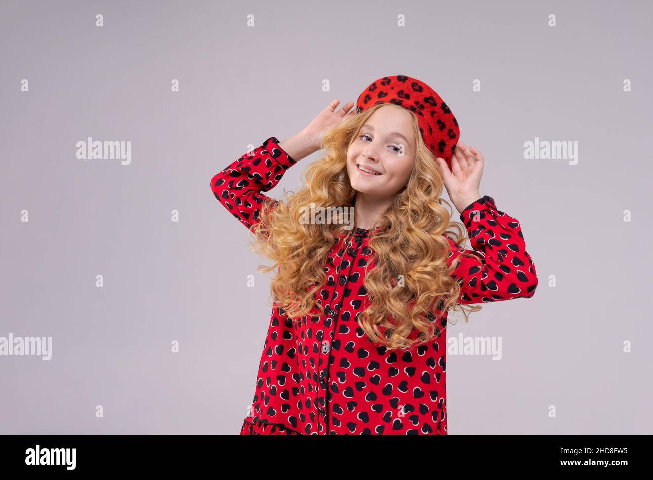 French fashion icon. Happy child wearing french red beret and dress on ...