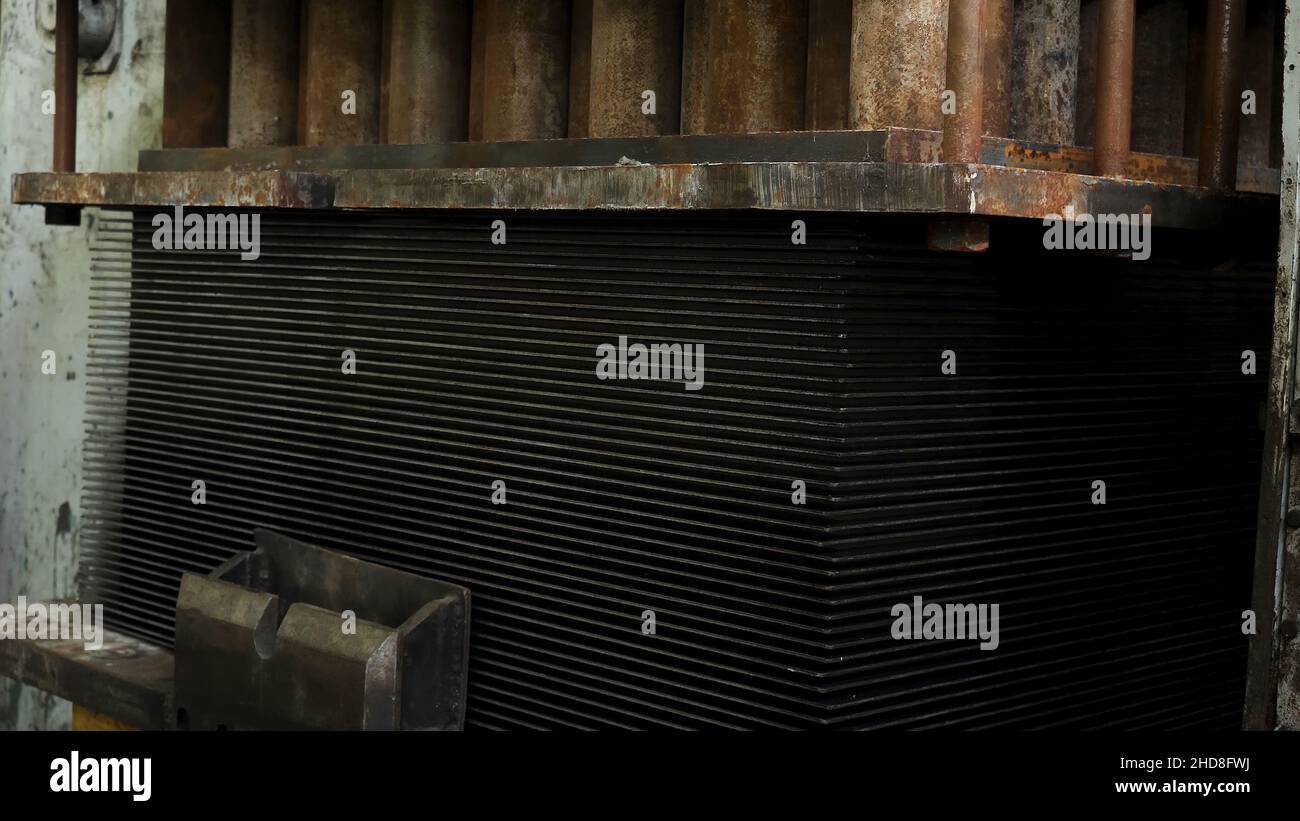 Automatic metal press machine during working process at a factory ...