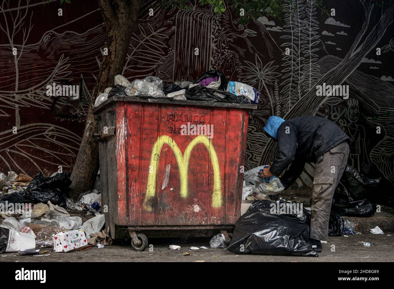 Beirut, Lebanon. 04th Jan, 2022. A boy rummages through garbage next to ...