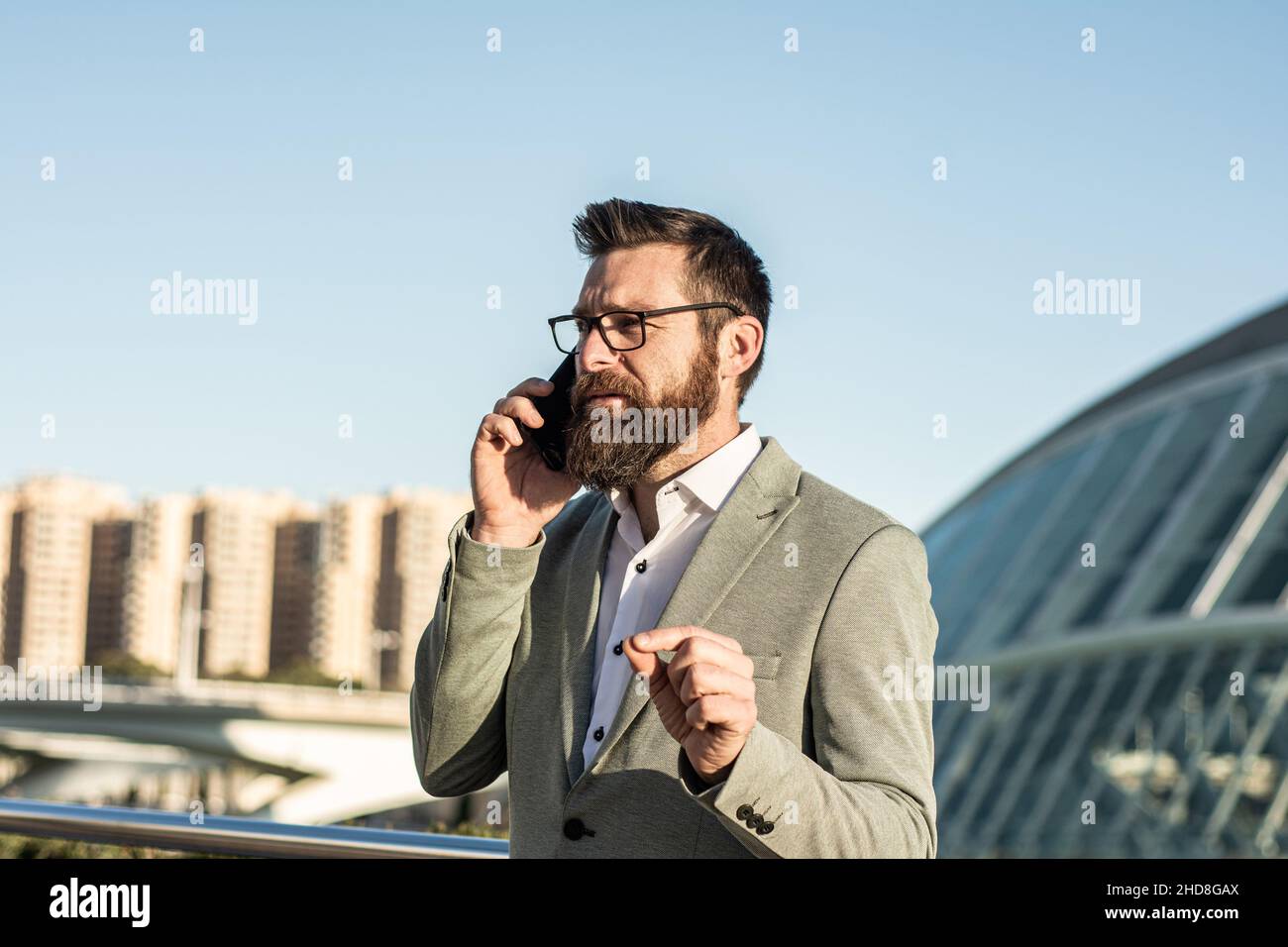 Mobile lifestyle. New technology. Handsome man with cell phone outdoors ...