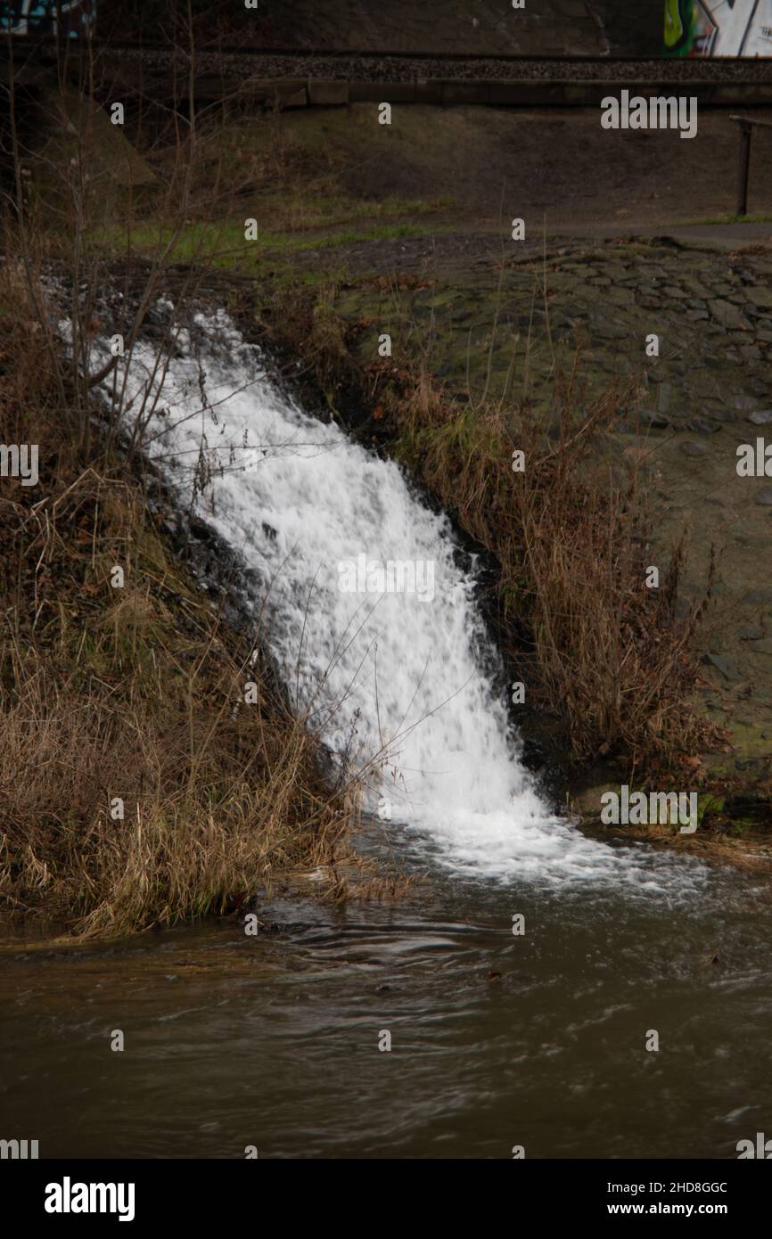 Waterfall with water fountains in the River Stock Photo - Alamy