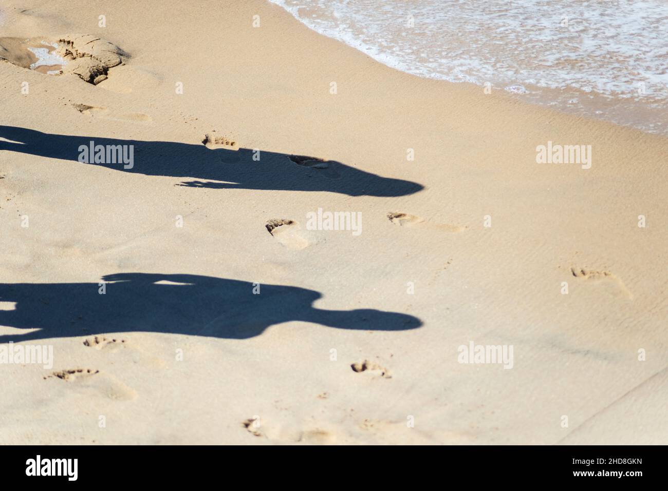 Human shadow on beach hi-res stock photography and images - Alamy
