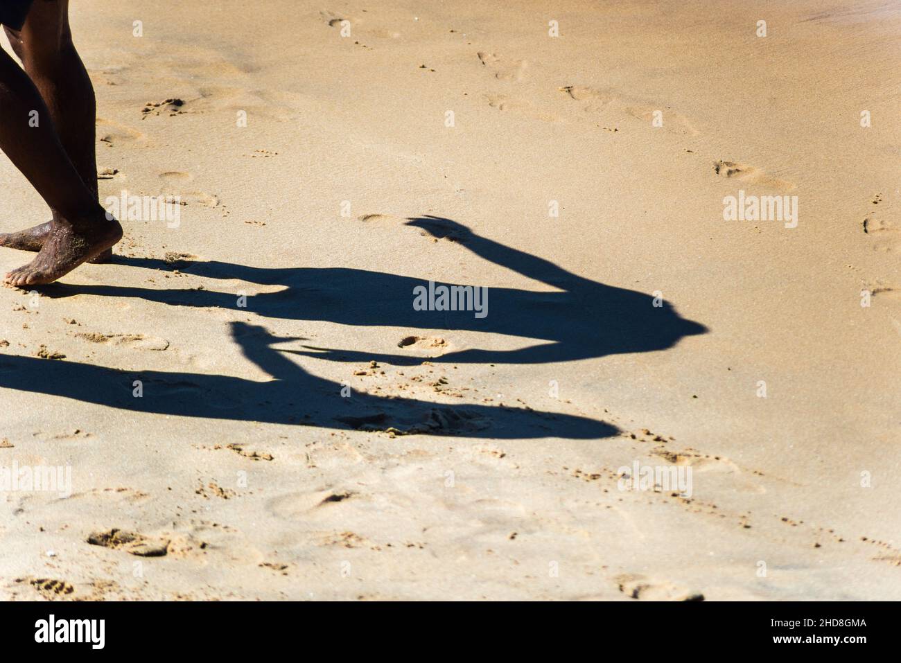 Human shadow on beach hi-res stock photography and images - Alamy