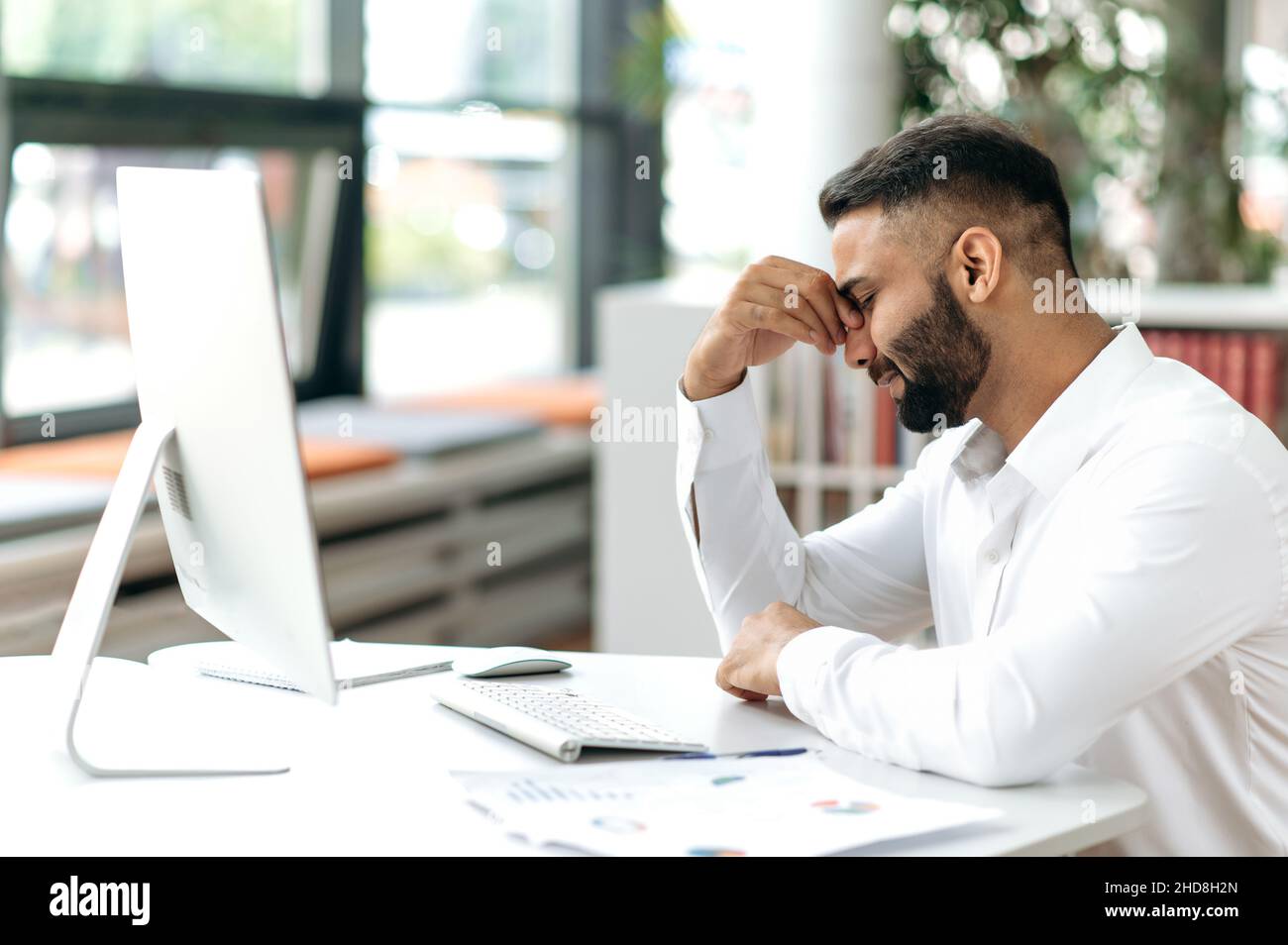 Indian young adult man upset worn out company owner, manager or office ...