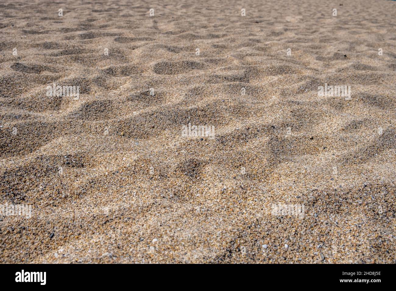 Sand background texture. Empty sandy beach, clean with footprints and ...