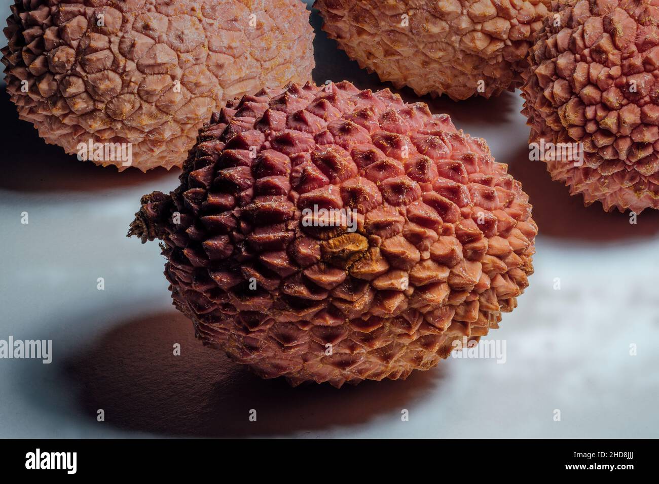 Lychees on a white background. Tropical fruit. Fresh red Litchi. Close ...