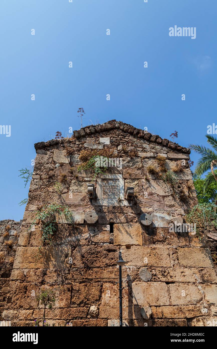 The ruins of the ancient city of Antalya. Ancient wall of rough gray ...