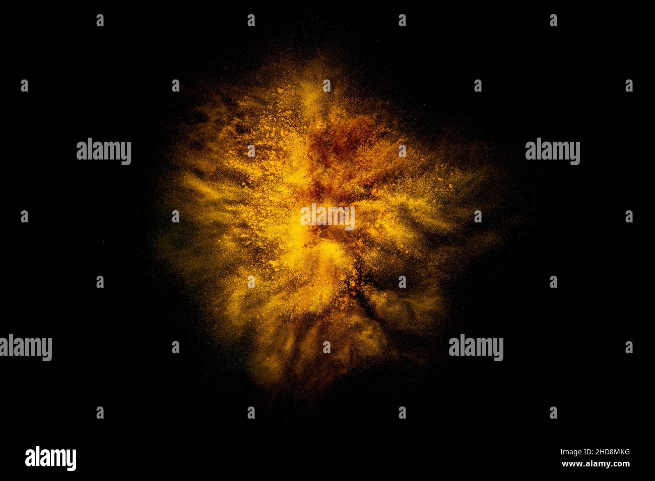 Explosion of yellow, golden color, fluid and neoned powder on dark ...