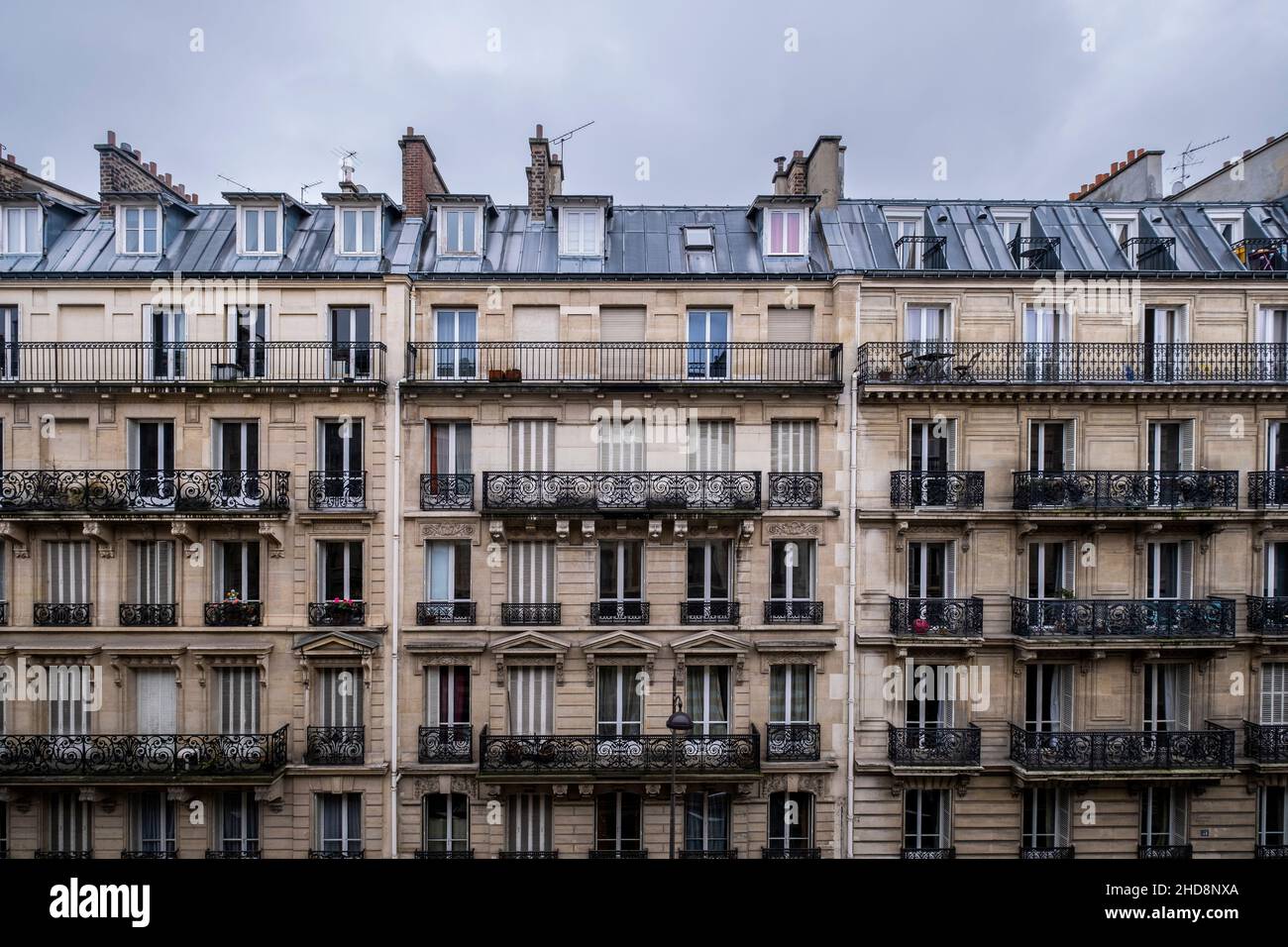 Typical facade of Parisian building with window wrought iron fences ...