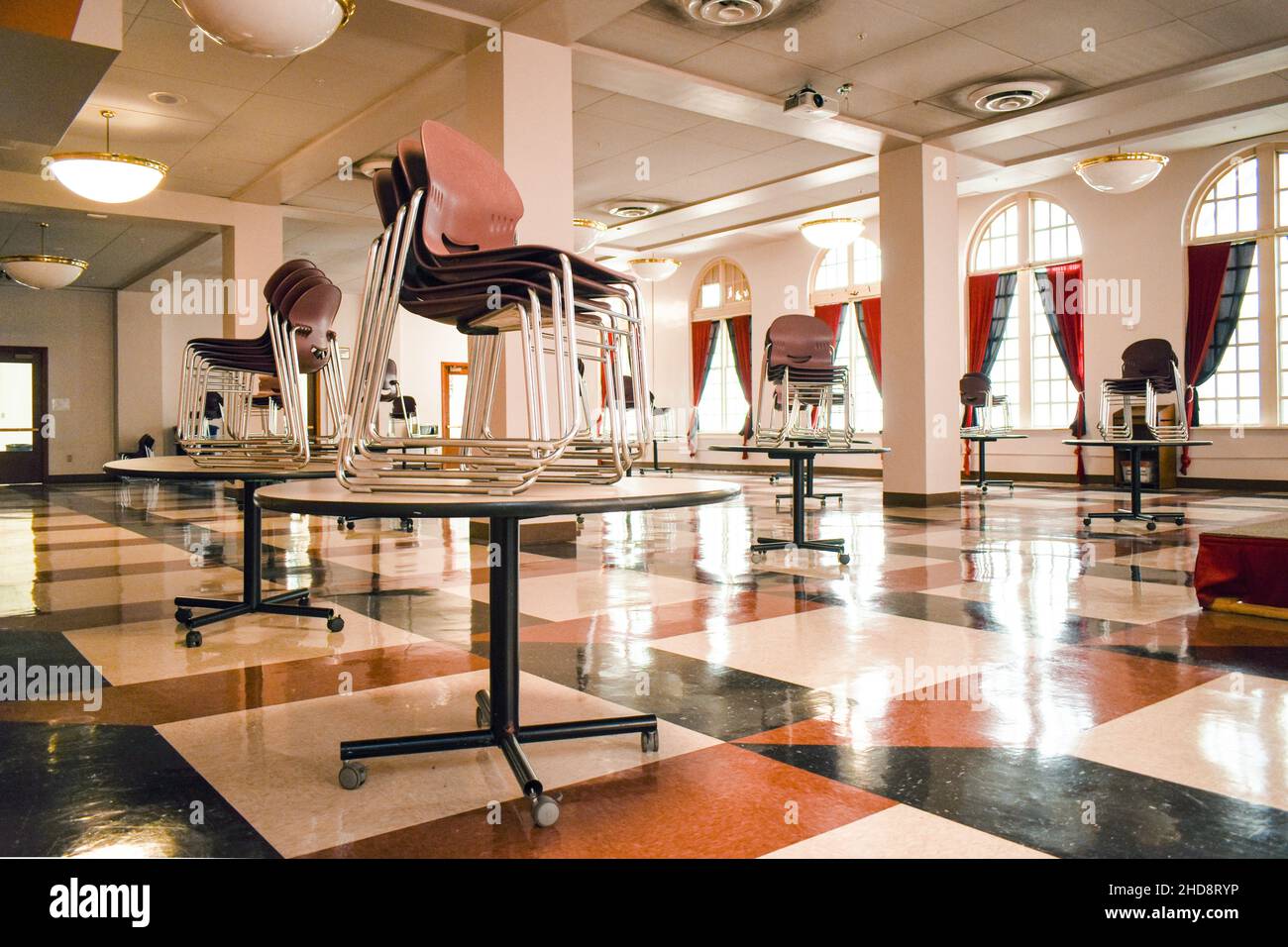 Closed High School cafeteria with chairs stacked on tables Stock Photo ...