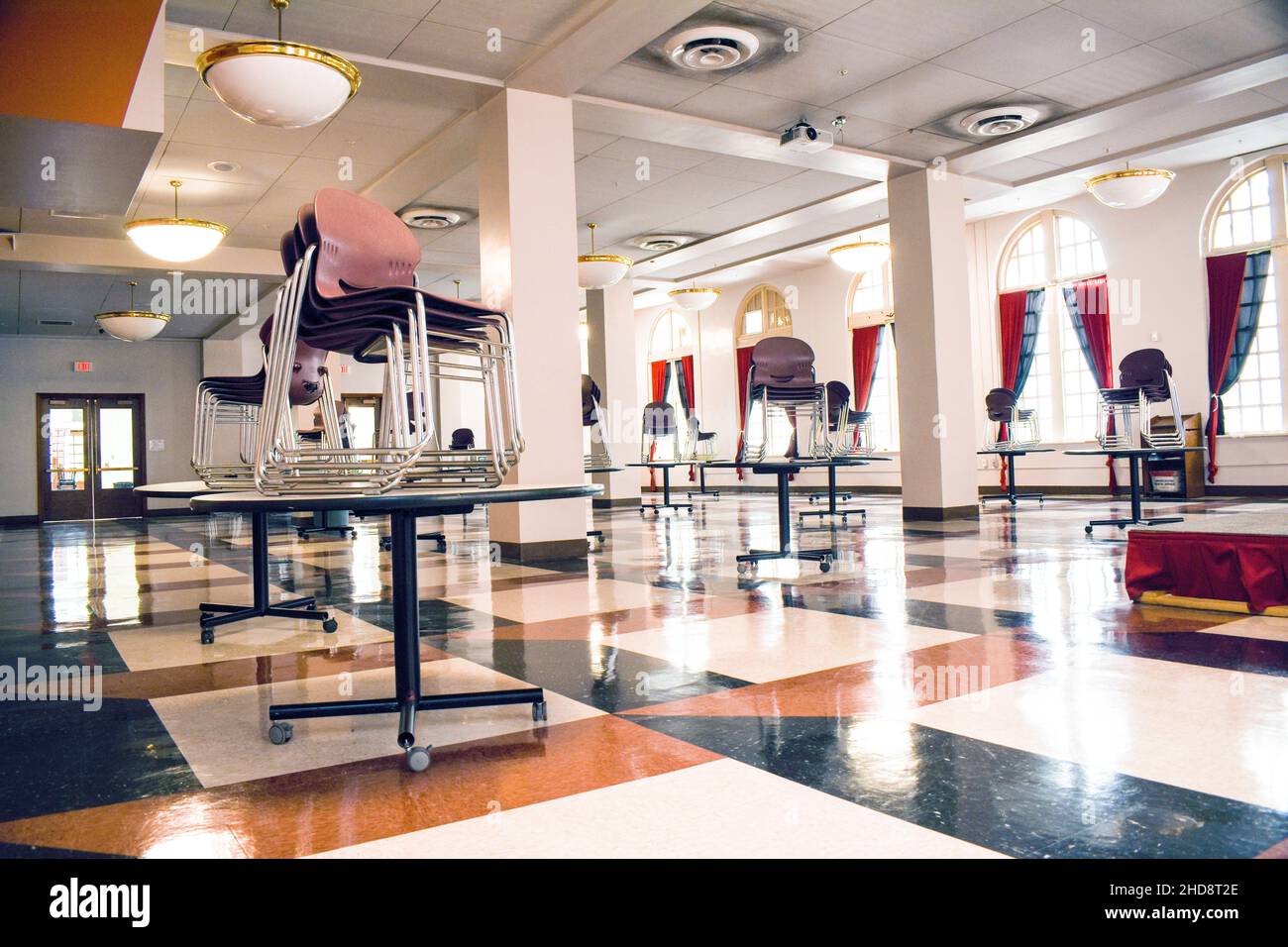 Closed High School cafeteria with chairs stacked on tables Stock Photo ...