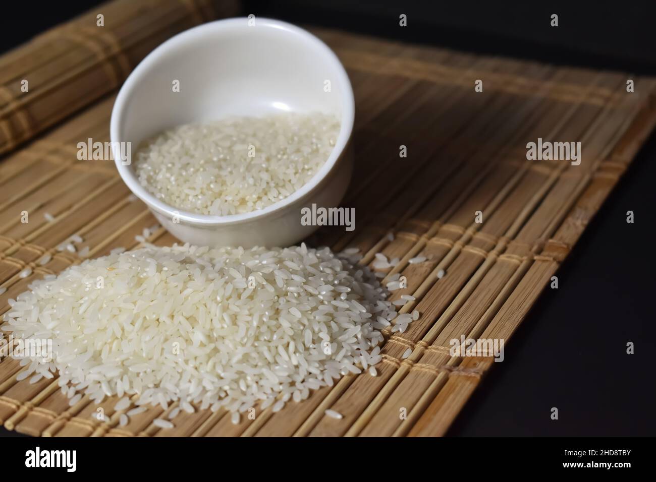 A Close up selective focus picture of a raw rice bowl with rice grains ...