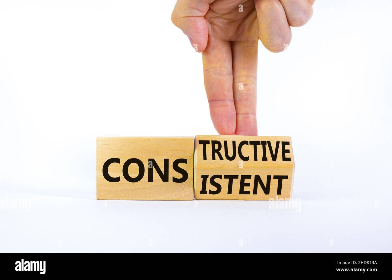 Constructive or consistent symbol. Businessman turns cubes, changes the ...