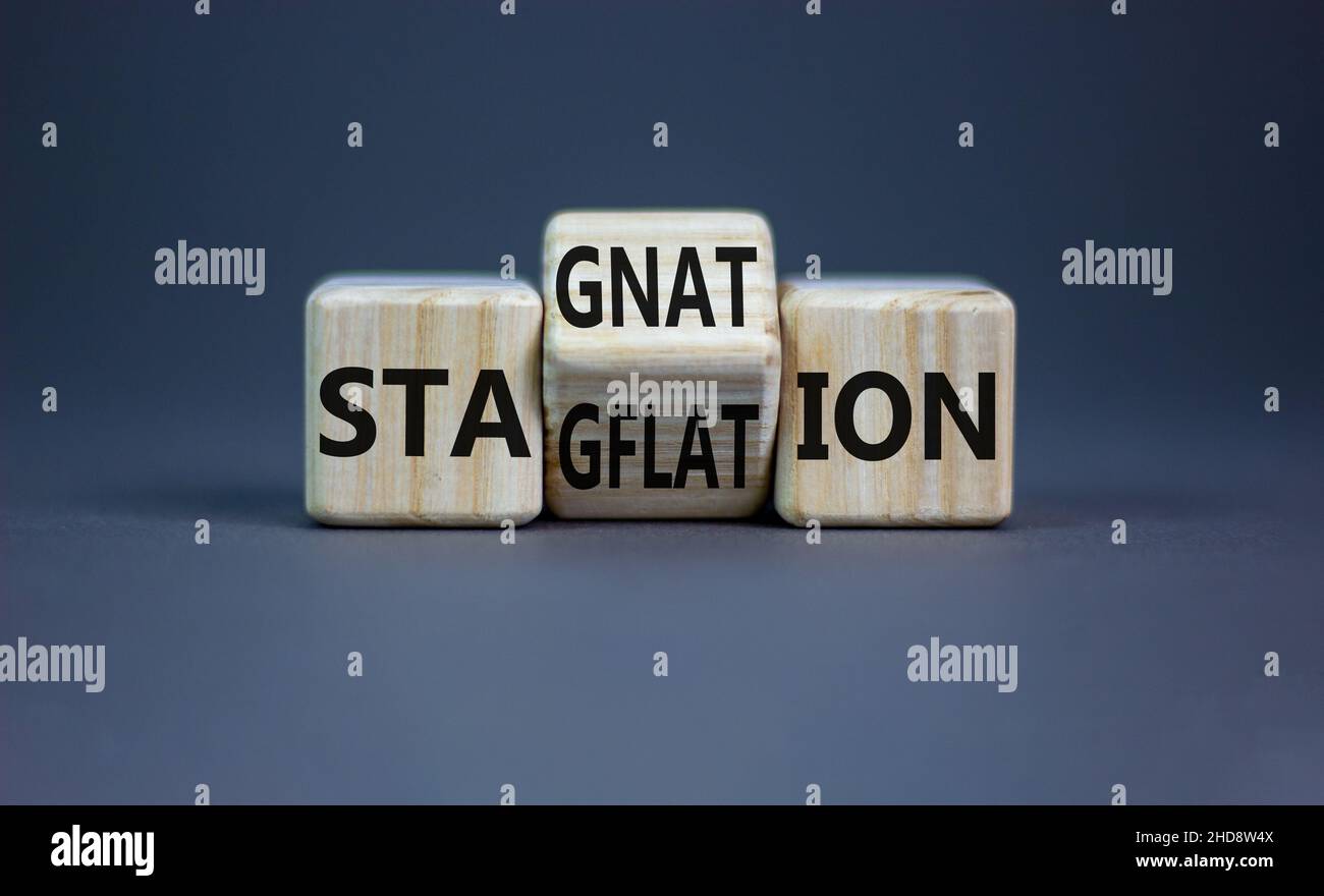Stagflation or stagnation symbol. Businessman turns cubes, changes the ...
