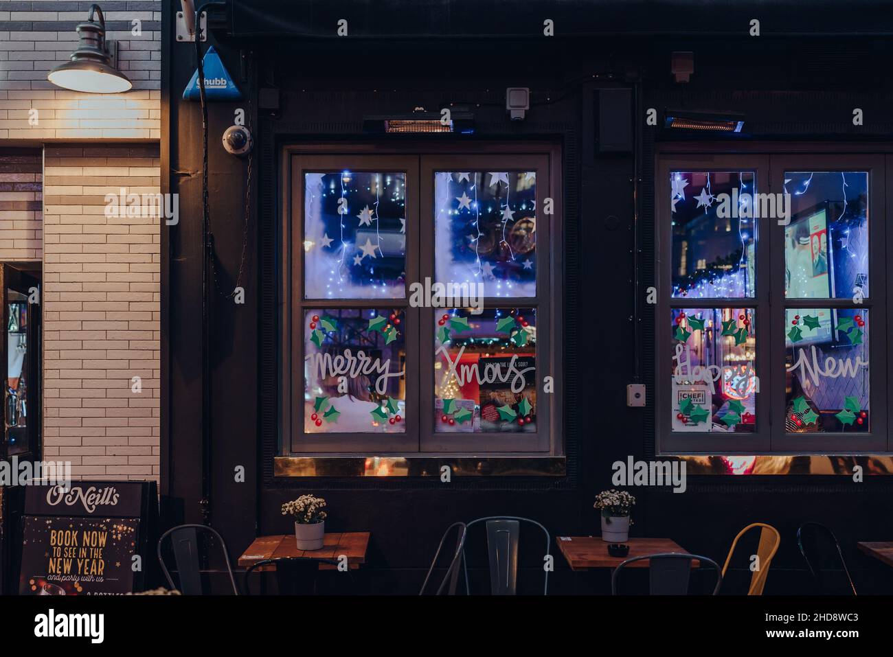 London, UK - November 23, 2021: Merry Christmas sign on the window of O ...
