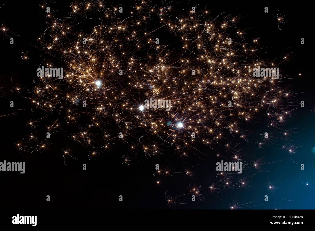 Dazzling firework exploding in the night sky Stock Photo - Alamy