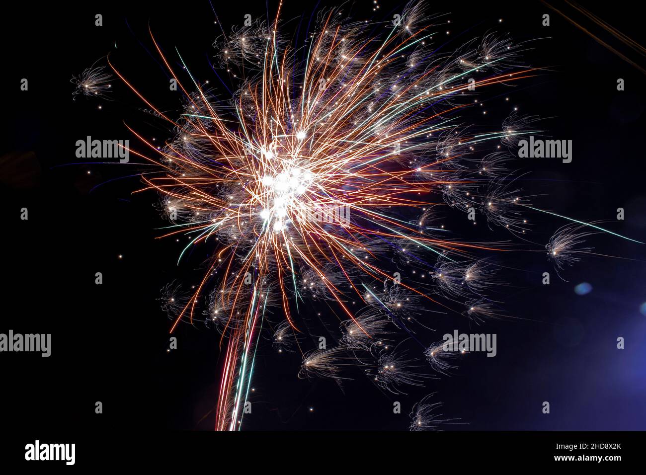 Dazzling firework exploding in the night sky Stock Photo - Alamy