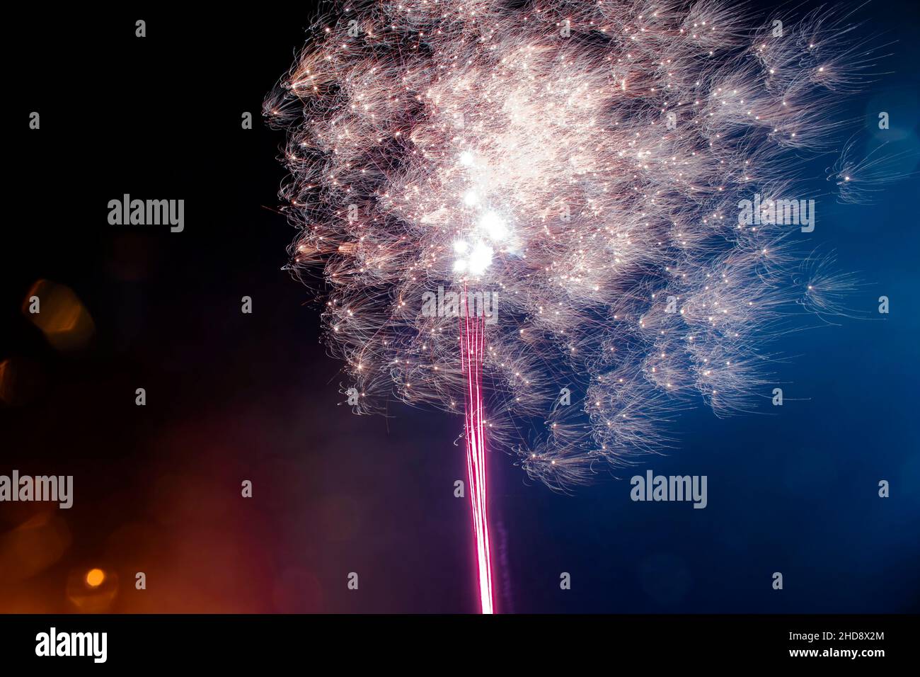 Dazzling firework exploding in the night sky Stock Photo - Alamy