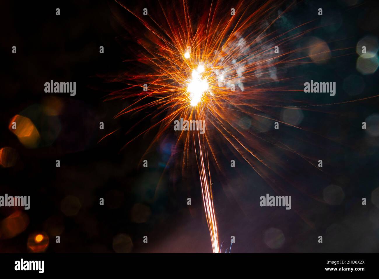Dazzling firework exploding in the night sky Stock Photo - Alamy