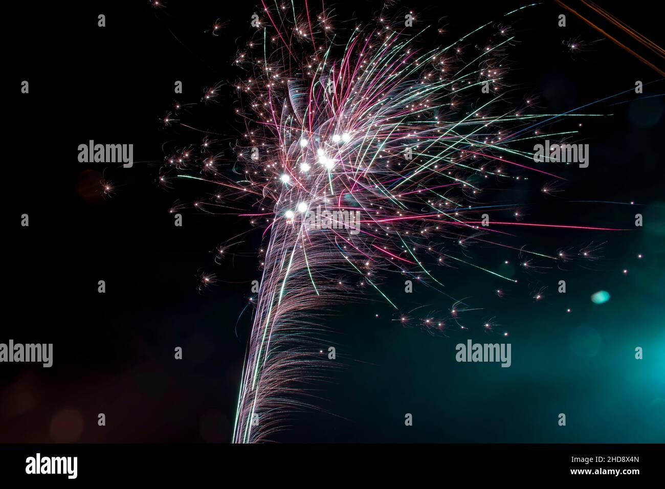 Dazzling firework exploding in the night sky Stock Photo - Alamy