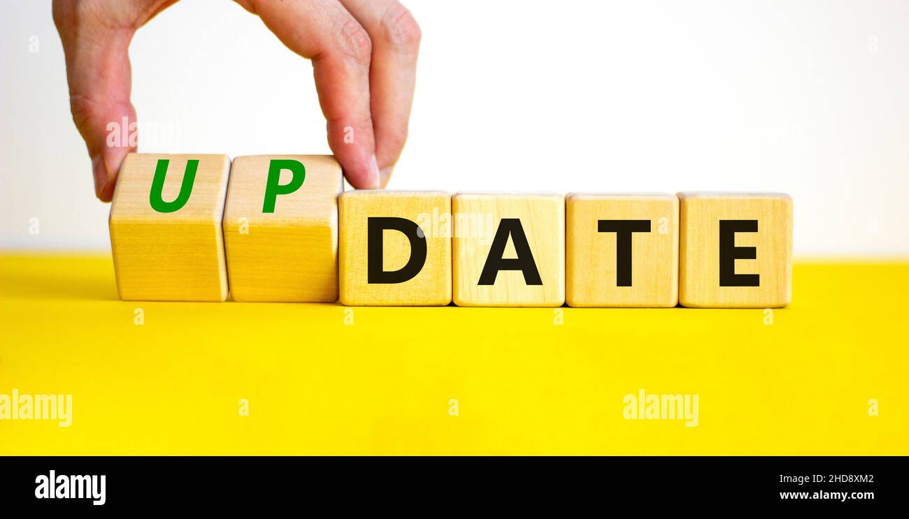 Date or update symbol. Businessman turns wooden cubes and changes the ...